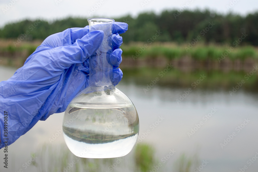Sample Of Water From A Lake River Water Sampling By A Laboratory sample-of-water-from-a-lake-river-water-sampling-by-a-laboratory