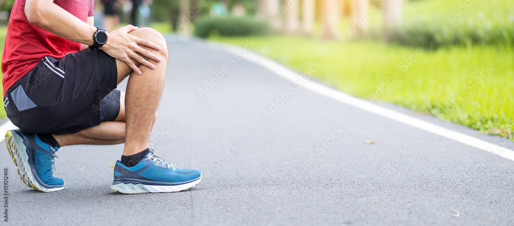 Young adult male with muscle pain during running. runner have knee ache ...
