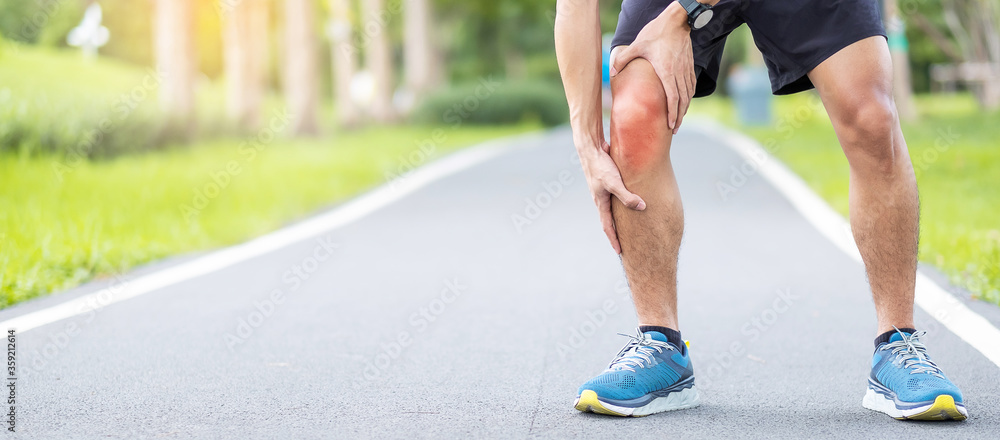 Young adult male with muscle pain during running. runner have knee ache ...