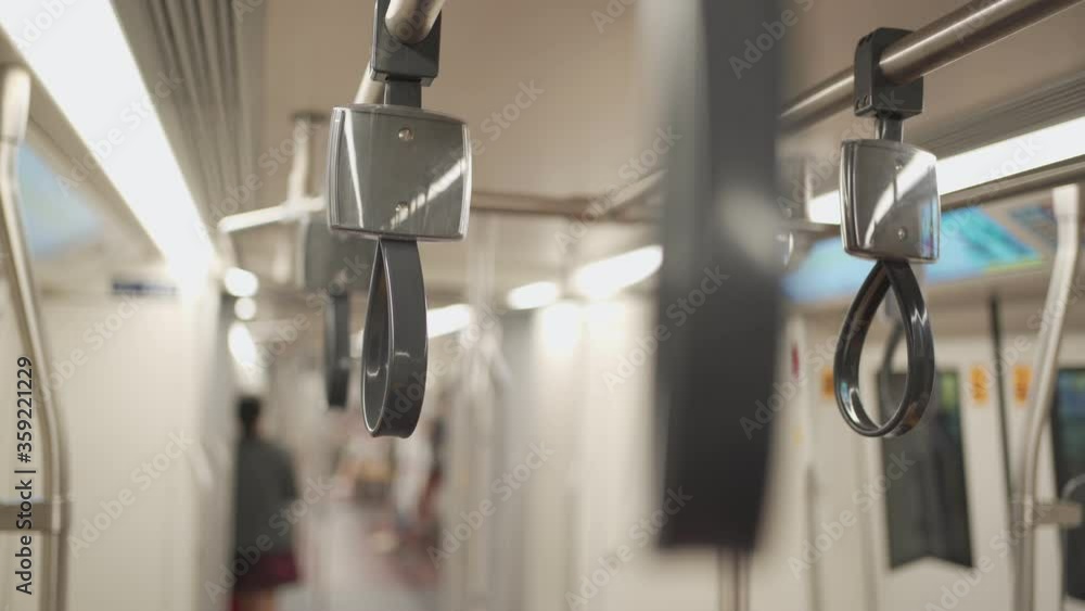 close up subway train handle, risk of public transport infectious disease, train handle ring ...