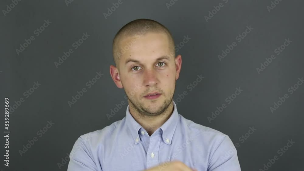 A funny, cute guy asks for a callback and makes a hand gesture ...