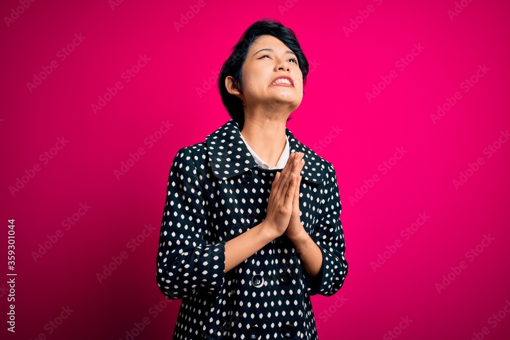 Young beautiful asian girl wearing casual jacket standing over isolated ...