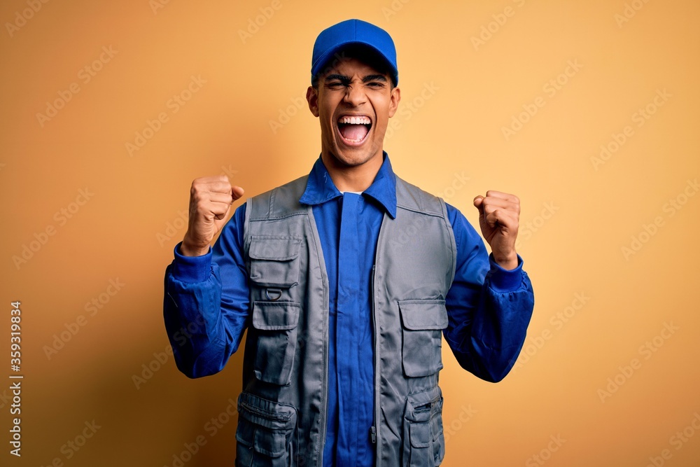 Fotografia do Stock: Young handsome african american handyman wearing ...
