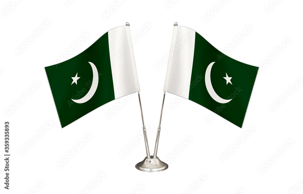 Pakistan table flag isolated on white ground. Two flag poles with flags ...