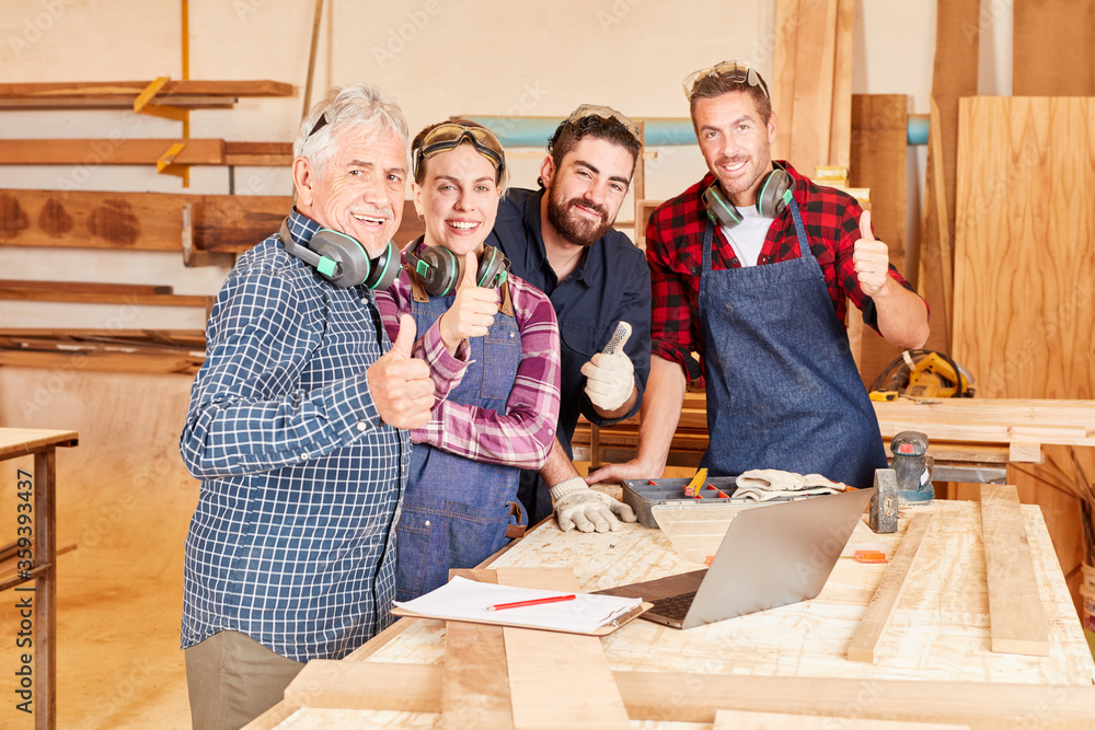 Proud craftsman team with thumbs up Stock Photo | Adobe Stock