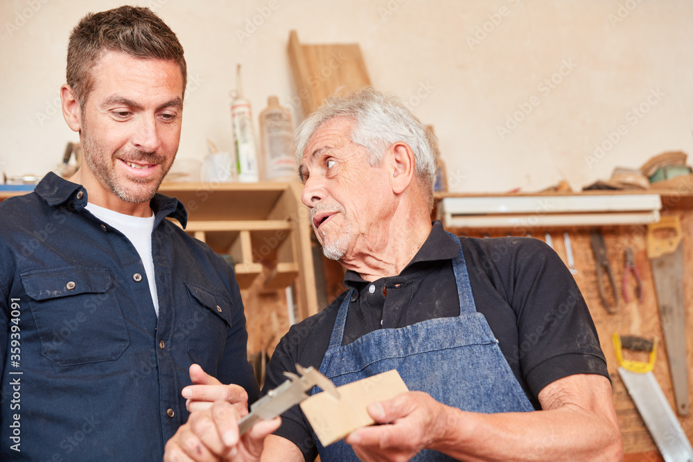 Master shows the work with wood and tools Stock Photo | Adobe Stock