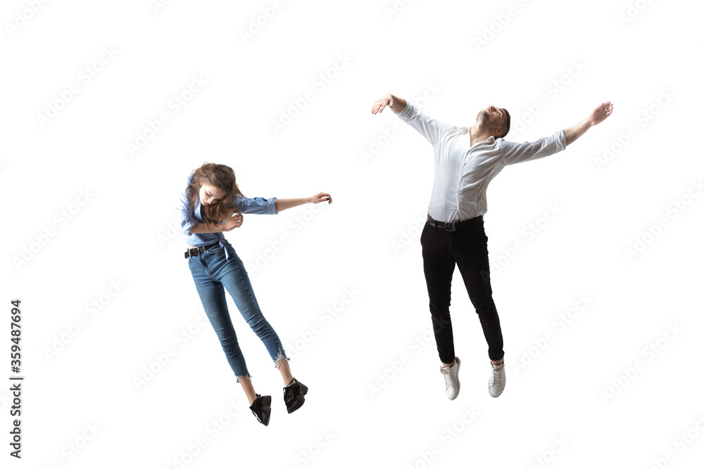 Mid-air beauty cought in moment. Full length shot of attractive young ...