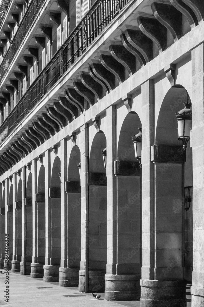 Columns with arches. Monumental stone structure. Strict lines in ...