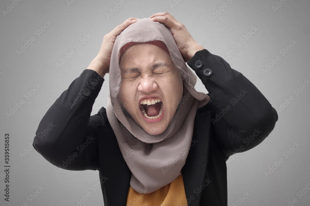 Portrait of Asian muslim lady wearing hijab shows angry screaming ...