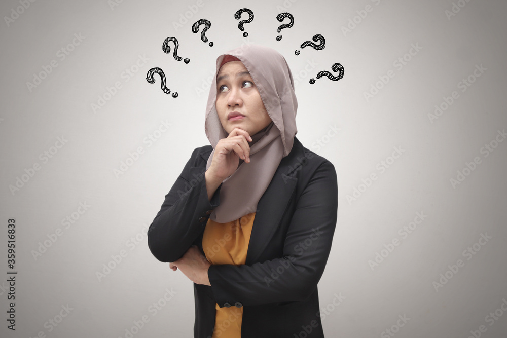 Beautiful Asian muslim business woman wearing hijab looking up and ...