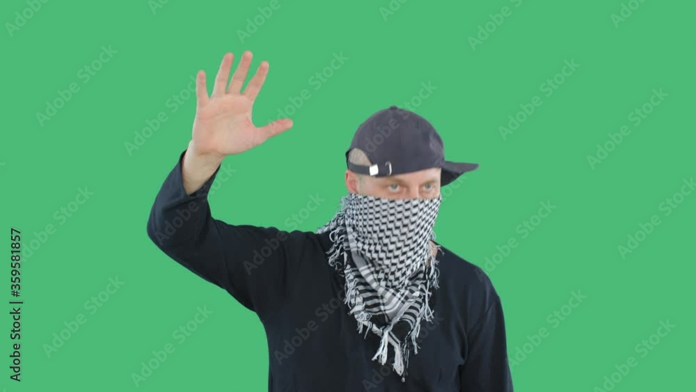 Aggressive protester raising hand during riot or political protest on ...