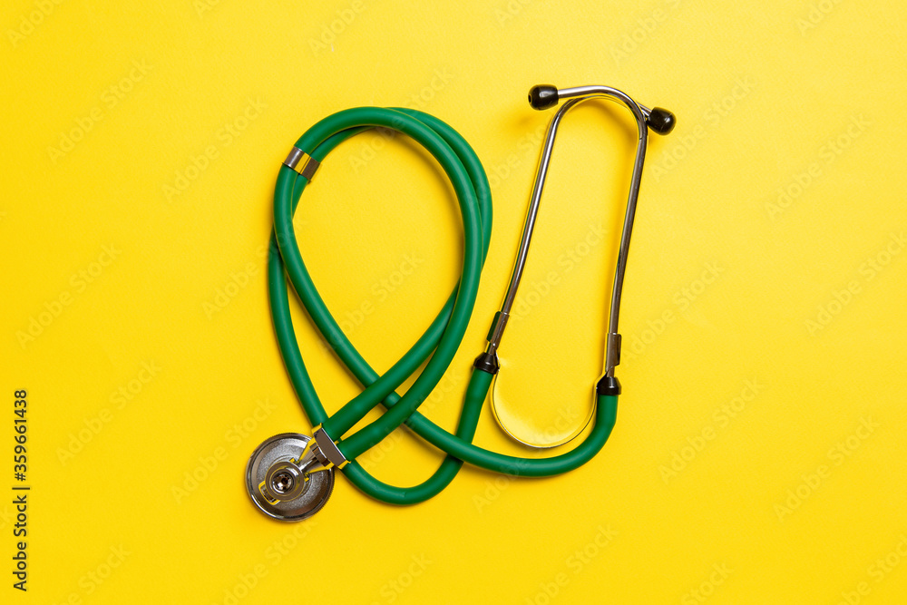Top view of green stethoscope on colorful background. Medical diagnosis ...