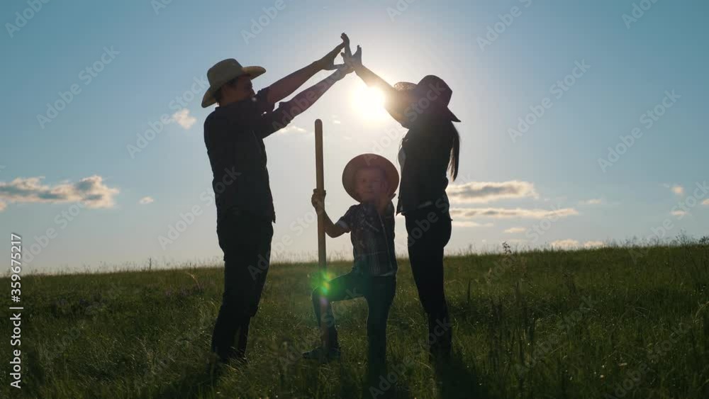 Teamwork. Happy family father, mother and son dream of their own home ...