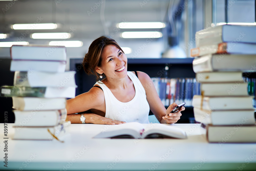 Working hard for great grades, asian smiling student girl sitting at ...