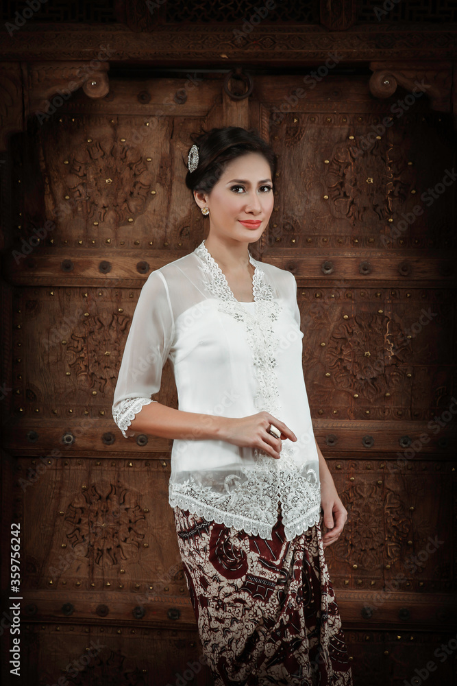 beautiful woman wearing an elegant kebaya, kebaya is a traditional ...