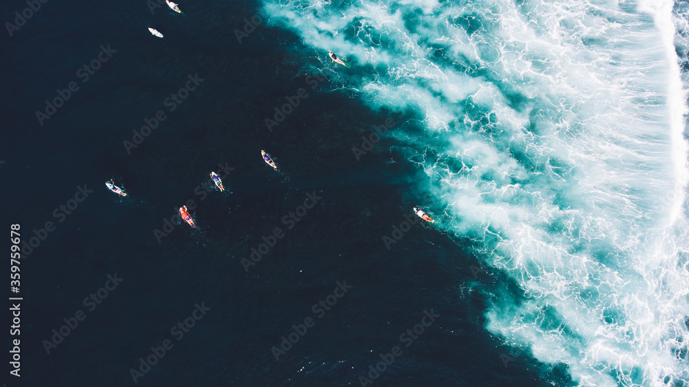 Top view aerial photo from drone of a swimming professional surfers are ...