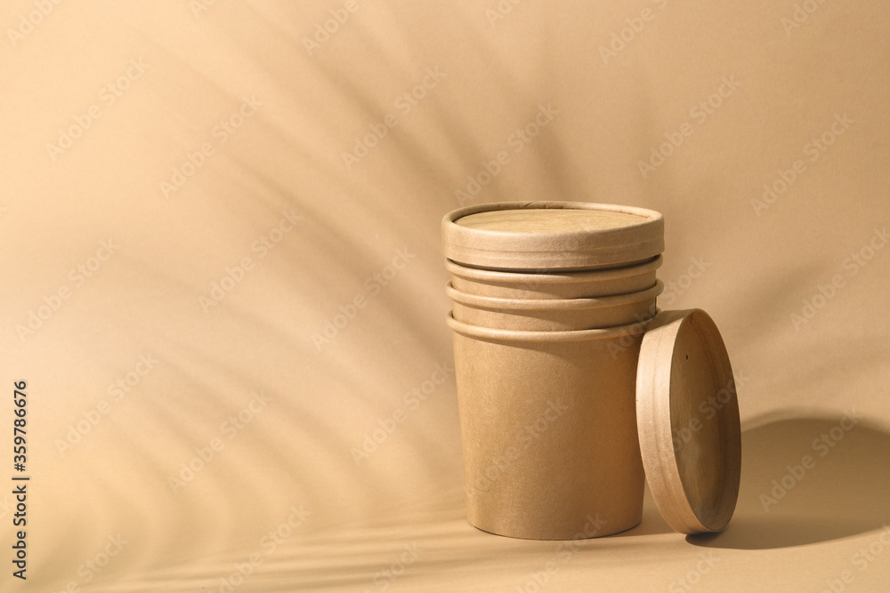 Craft paper soup cup with shadow on brown paper background. Empty ...