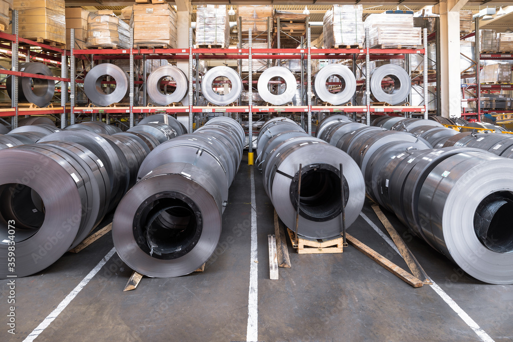 Tiered rack with sheet metal rolls. Internal warehouse of raw materials ...