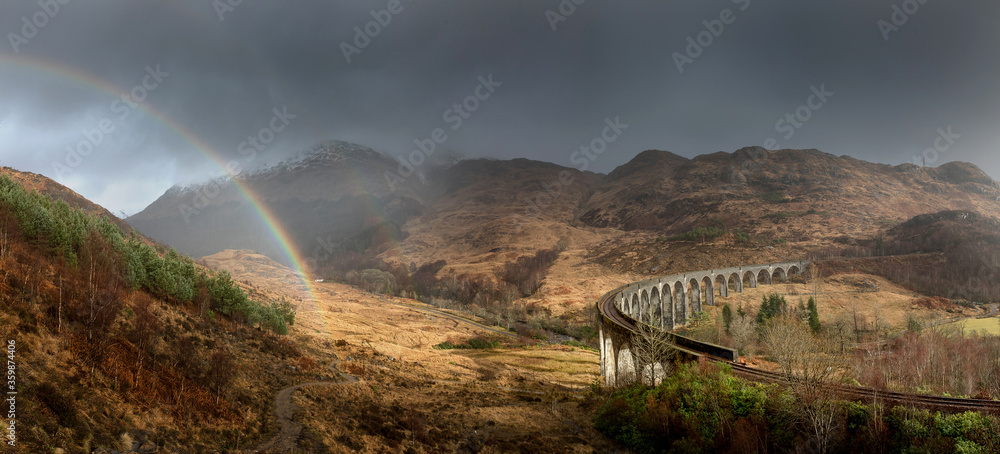 Glenfinnan Viaduct Scotland with a rainbow on a stormy winters day ...