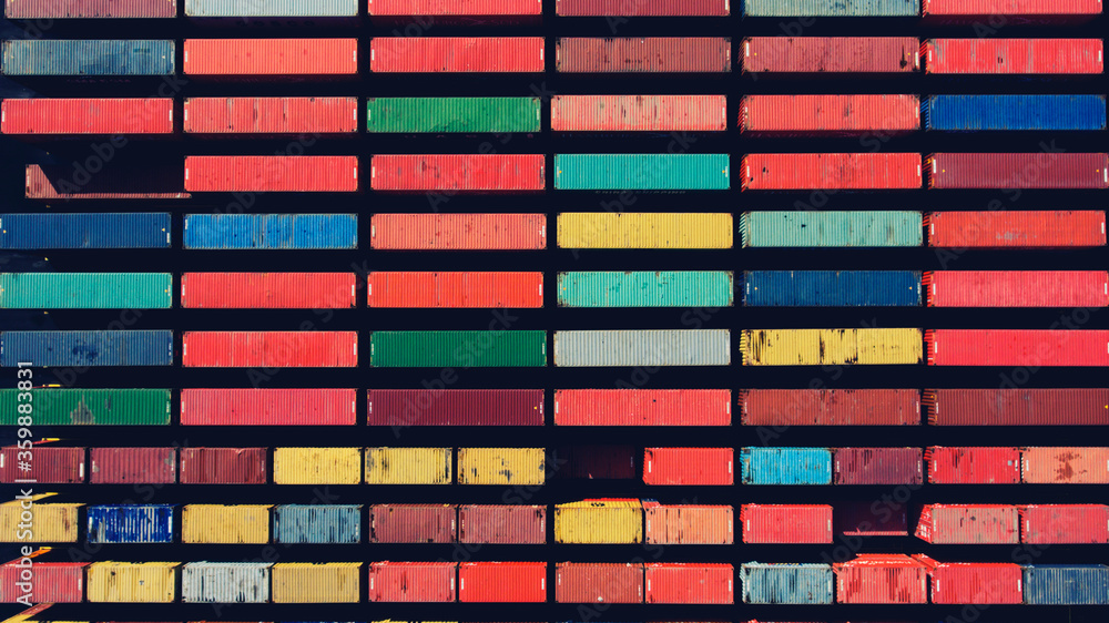 Top view aerial photo of freight containers in rows at harbor. Global ...