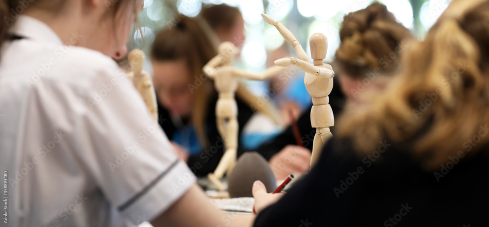 Visual Art high school students working from wooden mannequins ...