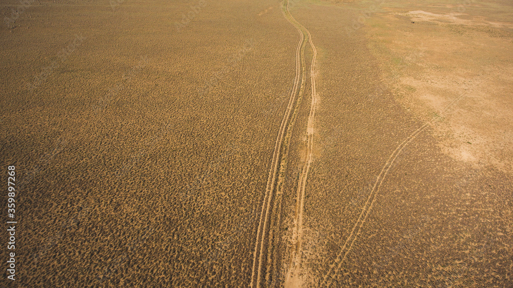 Top view aerial photo from drone of off road way with tires of car in ...