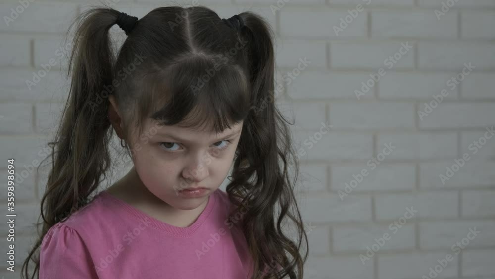 Self defense training. A little girl in boxing gloves takes a ...