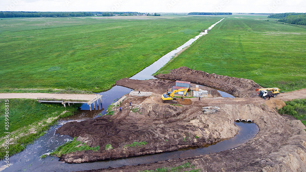 Construction and reconstruction of the road bridge. A bypass canal has ...