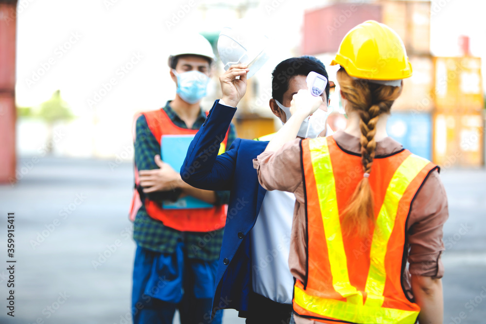 Temperature measurement with employee temperature meter before entering ...