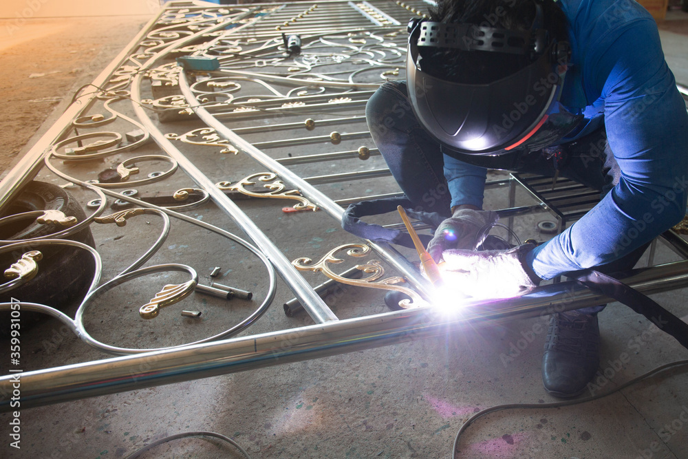 Welders are welding the various parts of building a stainless steel ...
