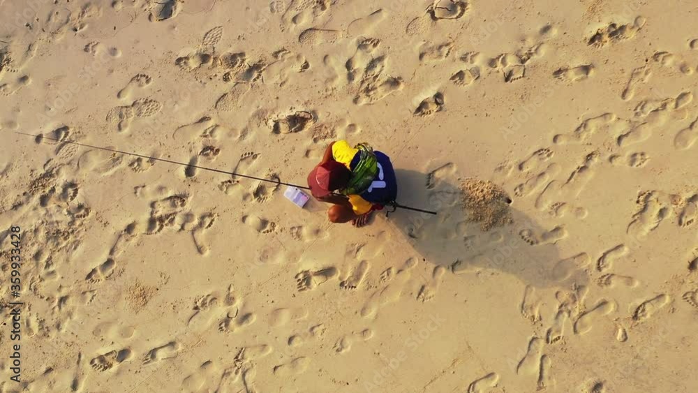 Top view of a man preparing all his tools for a fishing session at the ...