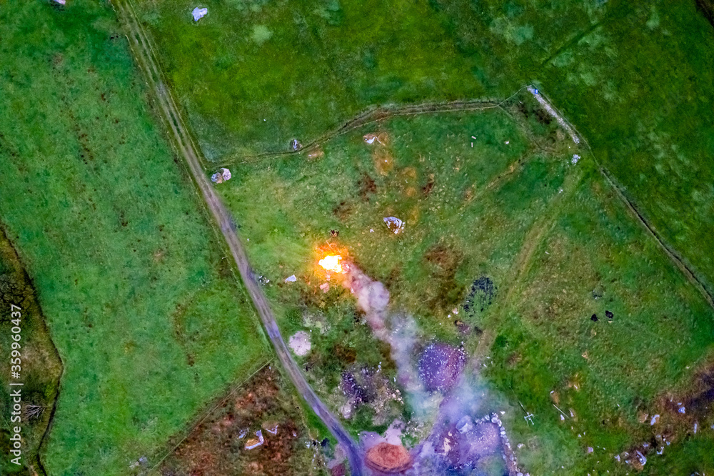 Recently extinguished bonfire used to burn cut gorse during ...