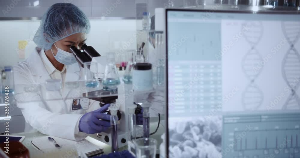 Female team working in modern laboratory. Studying genetic material ...