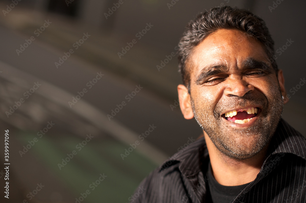 Laughing Indigenous Australian Man with Stubble Stock Photo | Adobe Stock