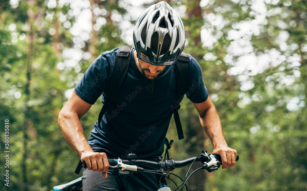 Horizontal outdoor image of cyclist man riding bike in the mountain ...