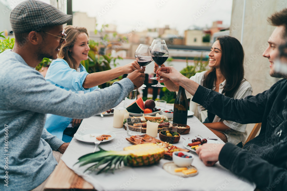Group of happy people celebrating outdoors, Multiethnic group of young ...