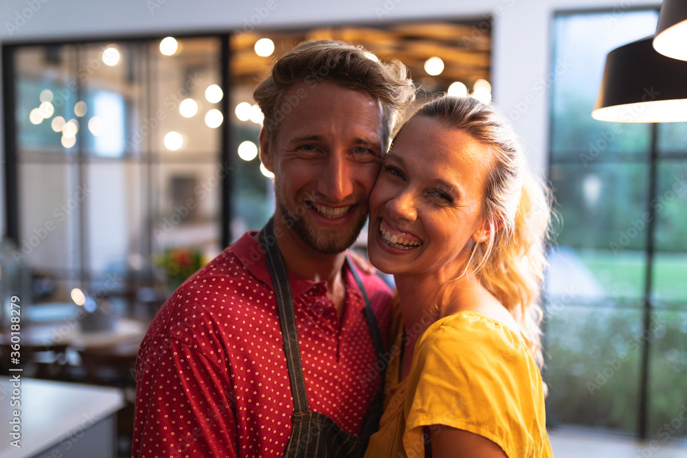Caucasian couple spending time in the kitchen and cuddling Stock Photo ...