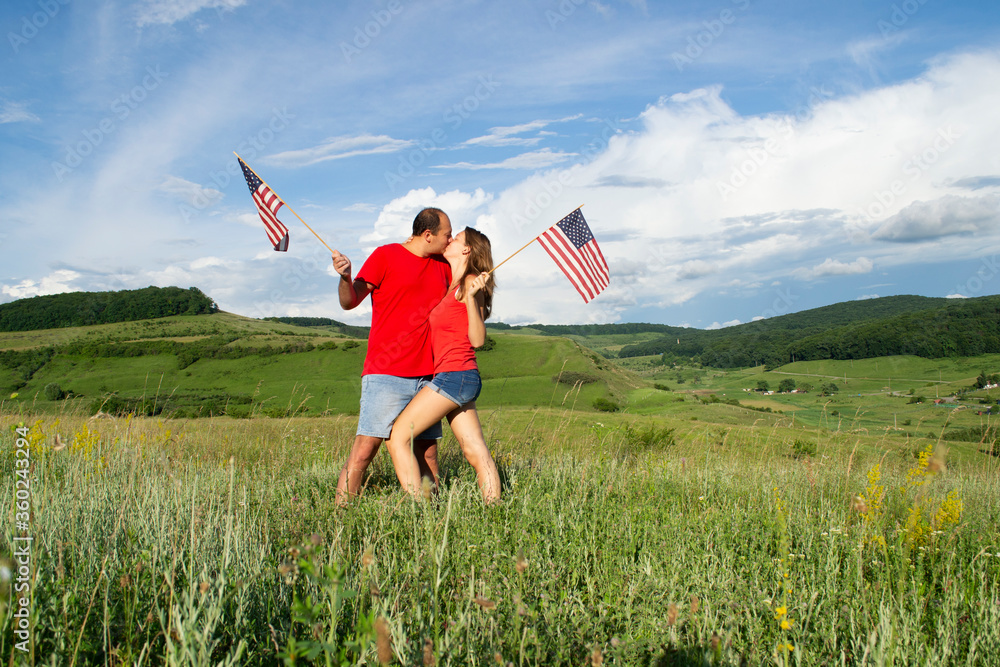 Young American couple family man and woman kissing each other ...