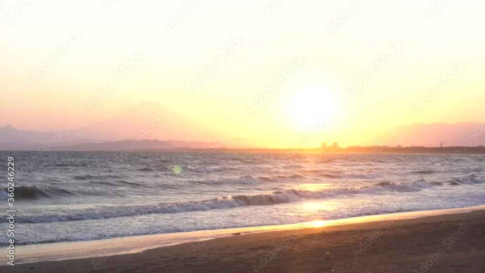 Sunset and sunrise 4k video at Japan beach and sea with Fuji San as ...