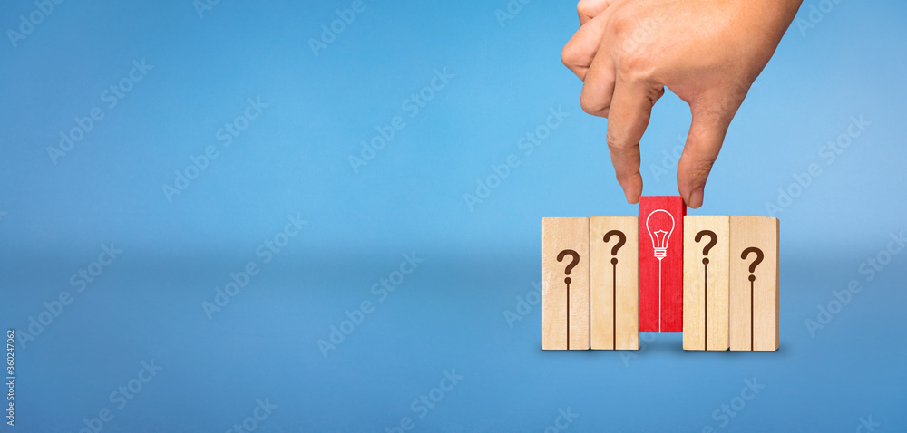 Question mark and Solution concept. Hand holding a red wooden block ...