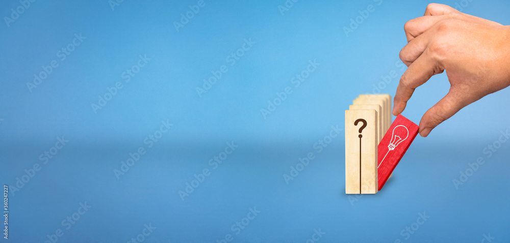 Question mark and Solution concept. Hand holding a red wooden block ...