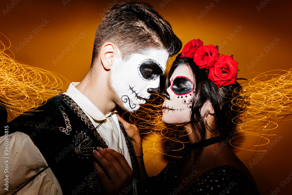 Zombie couple kissing on golden background. Amazing girl with halloween ...