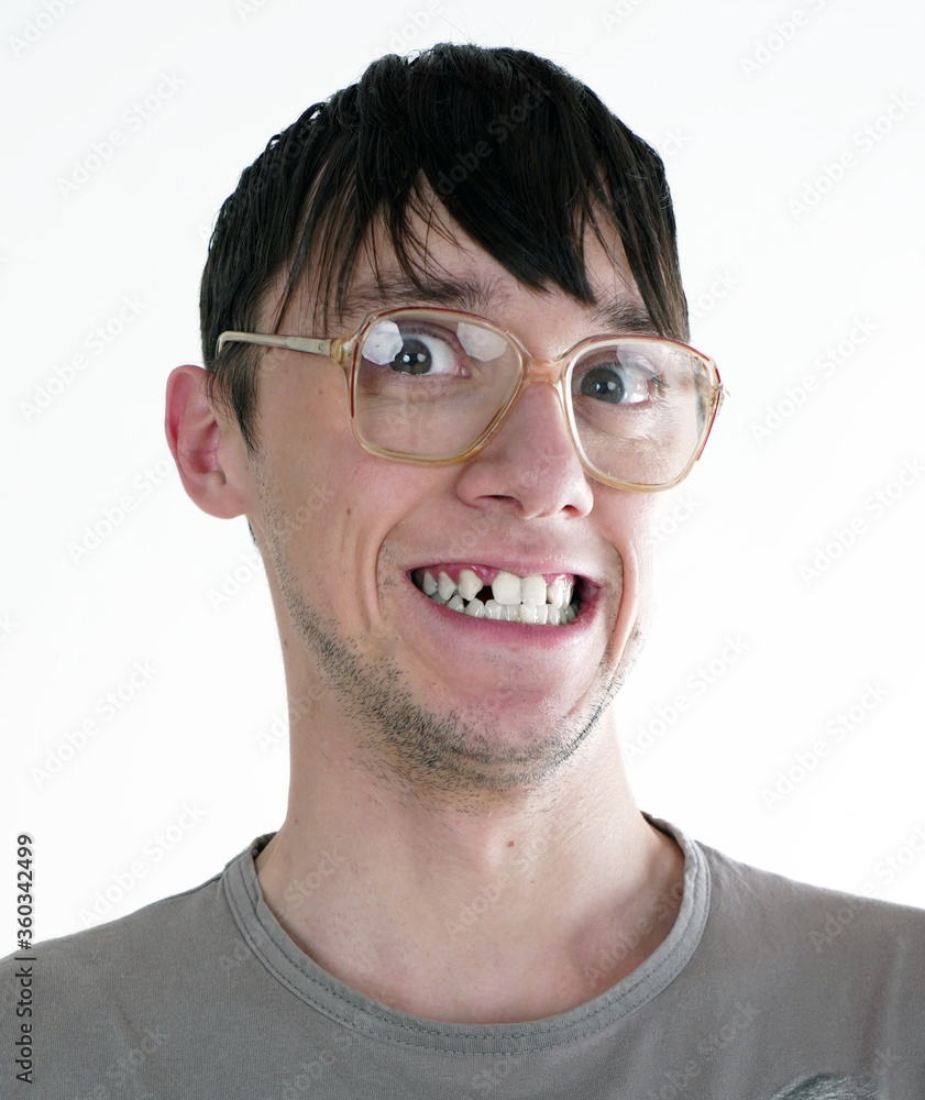 Close up portrait of Caucasian young man with greasy long black hair ...