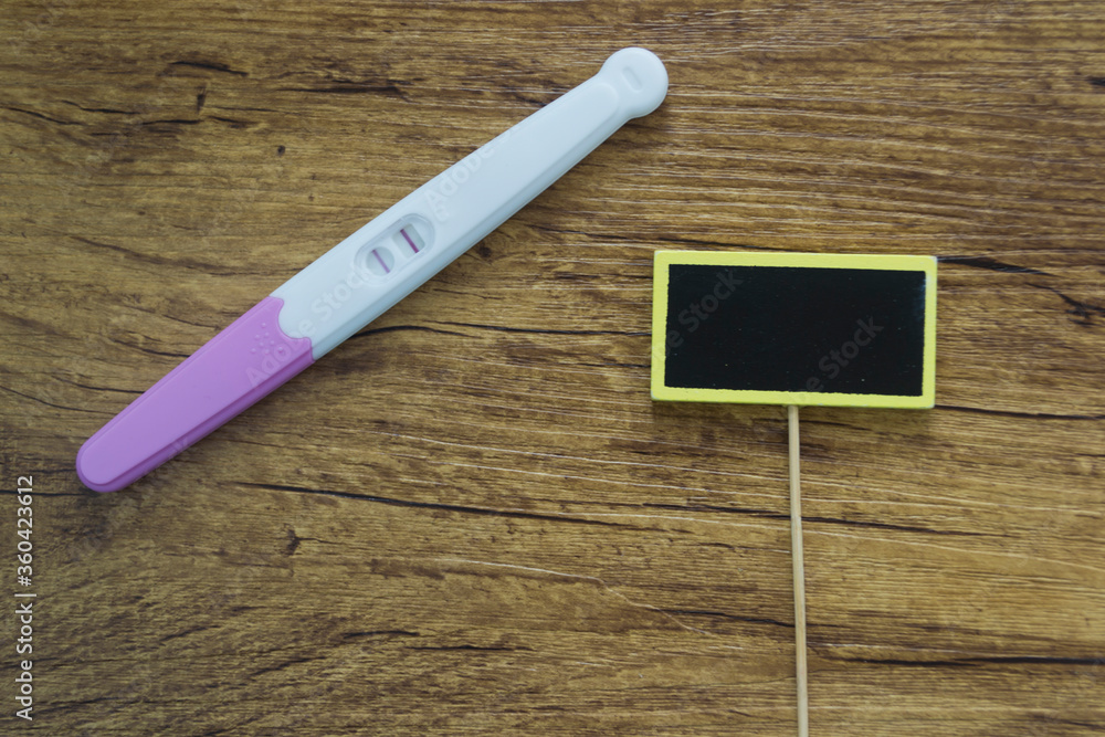Positive pregnancy test. Stock Photo | Adobe Stock