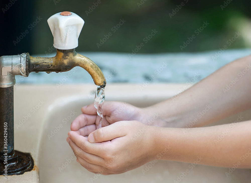 Hands open for drinking tap water. Pouring fresh healthy drink. Good ...