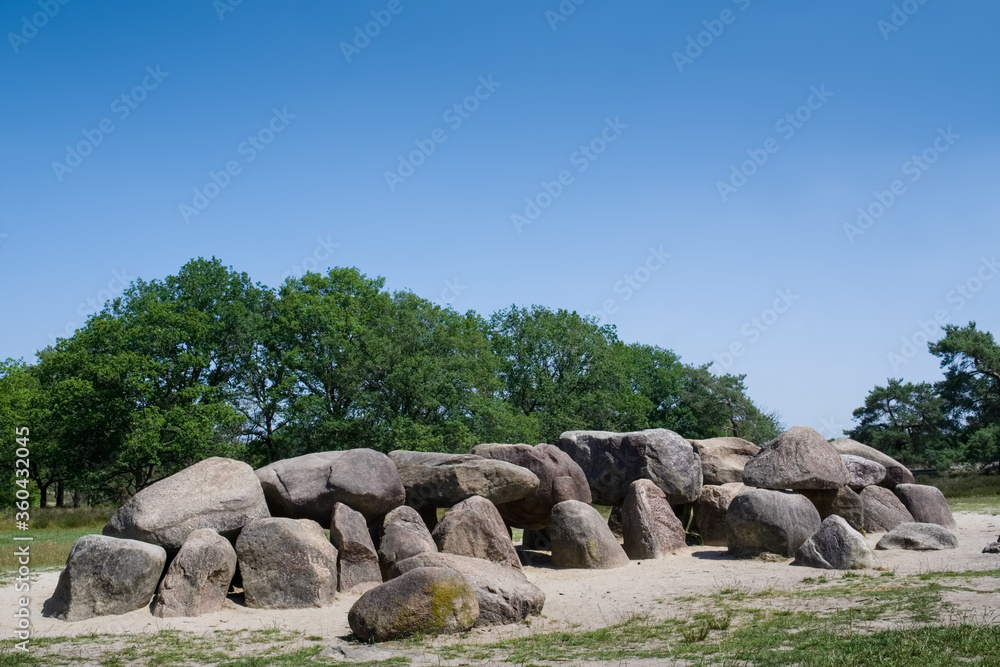 A dolmen or hunebed is a type of single-chamber megalithic tomb with ...