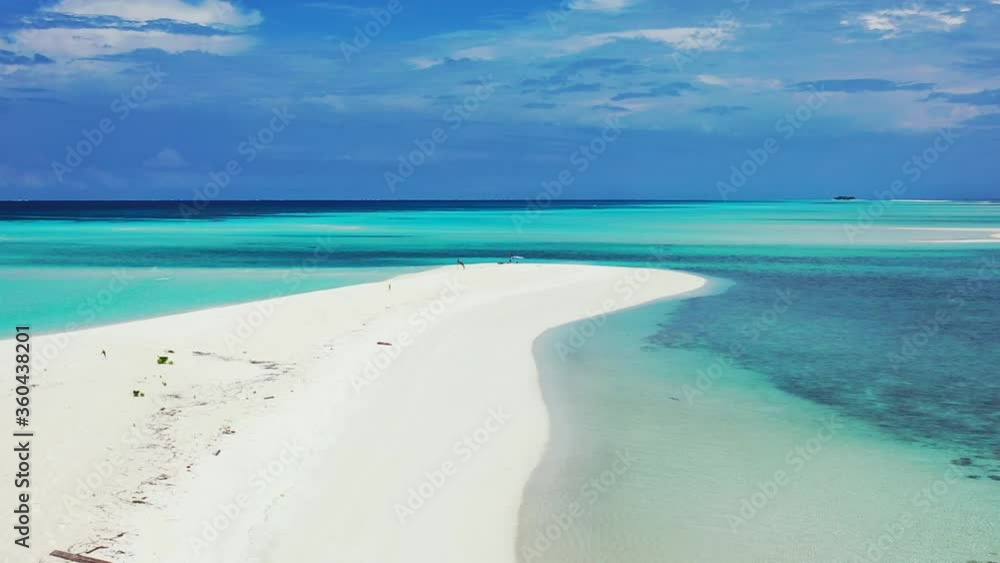 Zoom in view of a calm and quiet sandbar of a tropical island ...