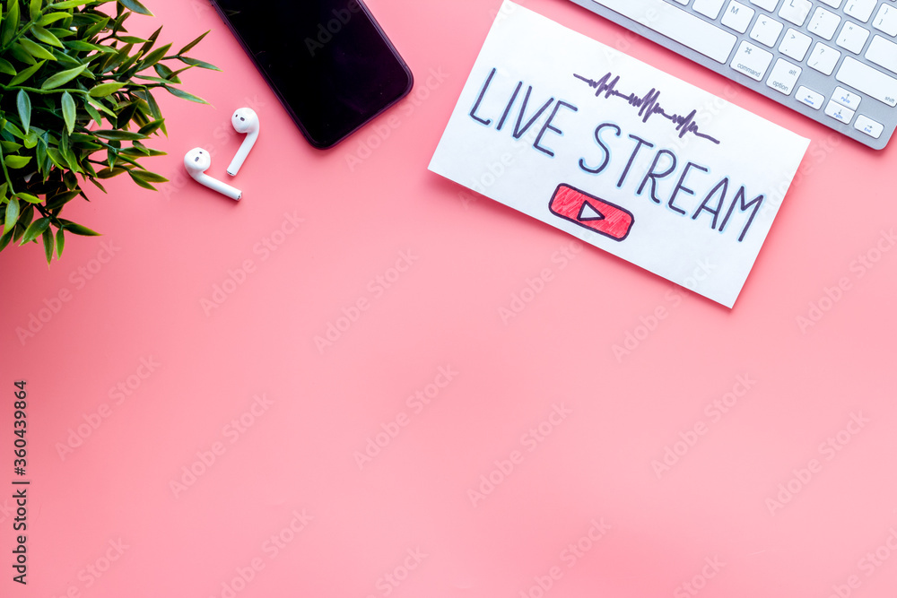 Online streaming social media concept. Paper tablet on office desk top ...