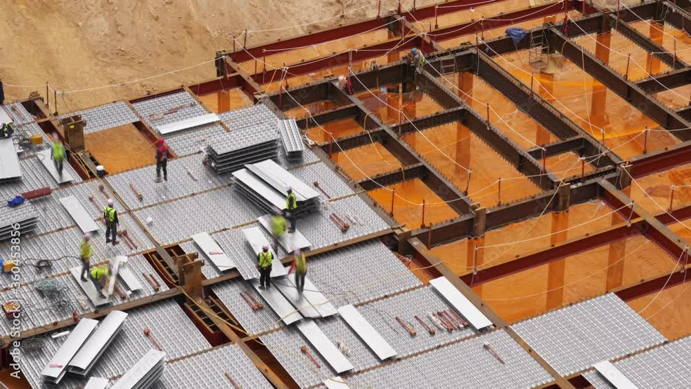 Modern building construction site, time lapse shot, workers place mold ...