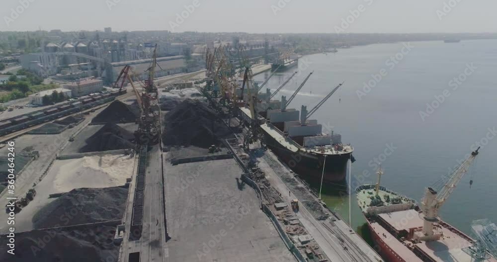 The cargo ship is filled with grain. Dry cargo ship loading in port ...